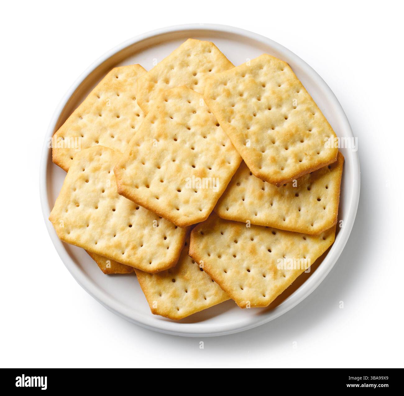 plate of crackers isolated on white background, top view Stock Photo ...