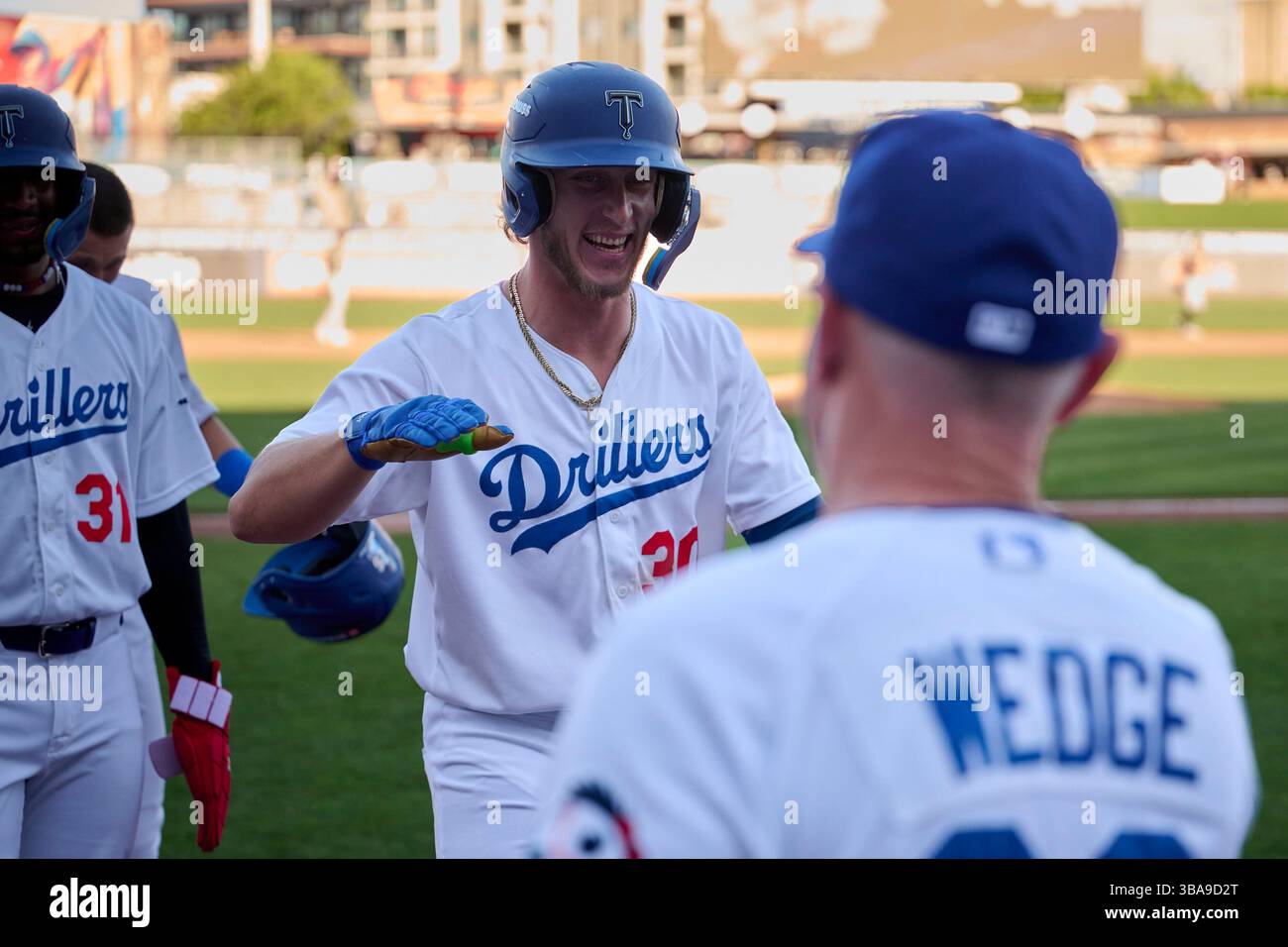 Tulsa Drillers Damon Keith (30) celebrates hitting a home run with ...