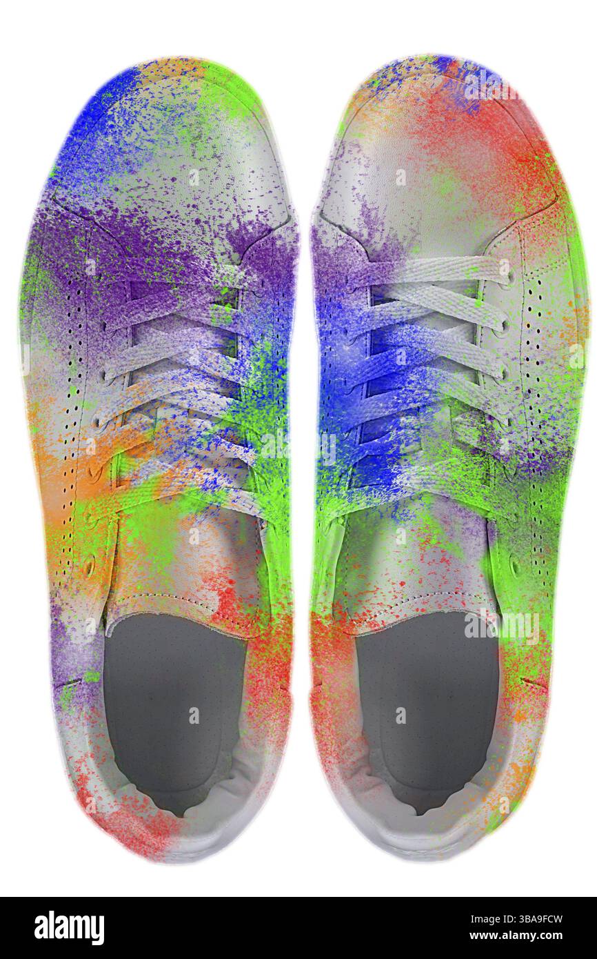 Trainers covered with splashes of colour. Colourful trainers on a white ...