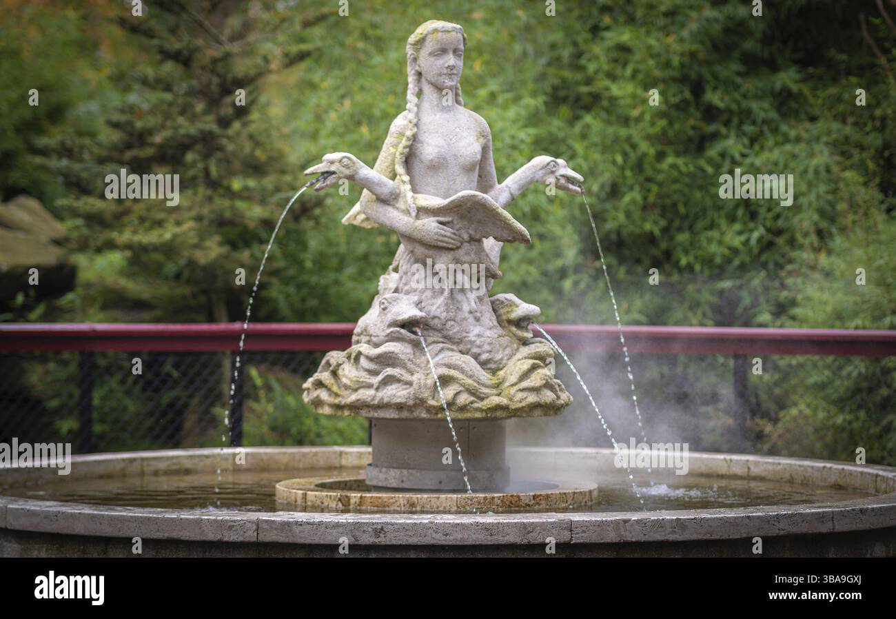 A beautiful fountain with statue of a woman with geese and frogs ...