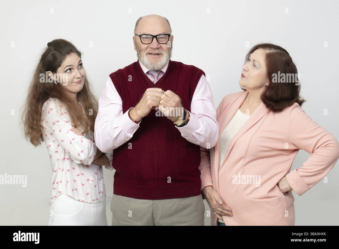A photo of a father being looked at reproachfully by an adult daughter ...