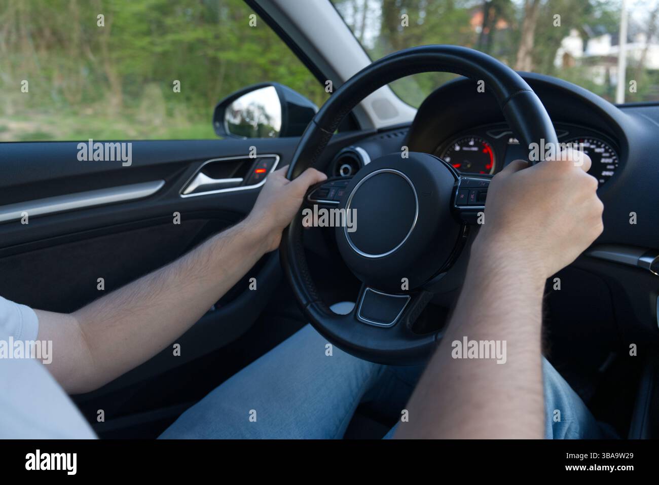 Driver grips steering wheel hi-res stock photography and images - Alamy