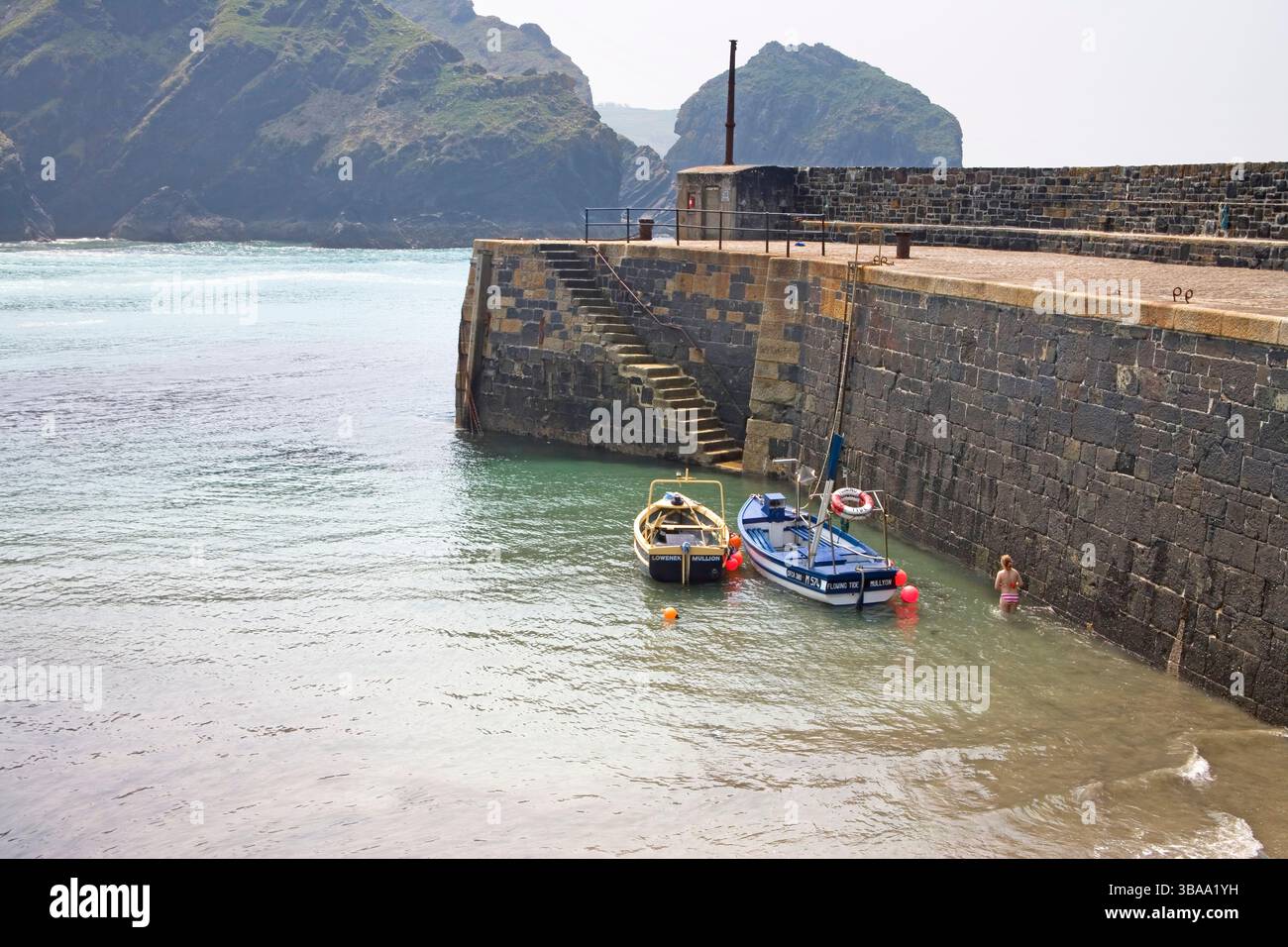 boats moored in the sheltered harbour at mullion cove on the south ...
