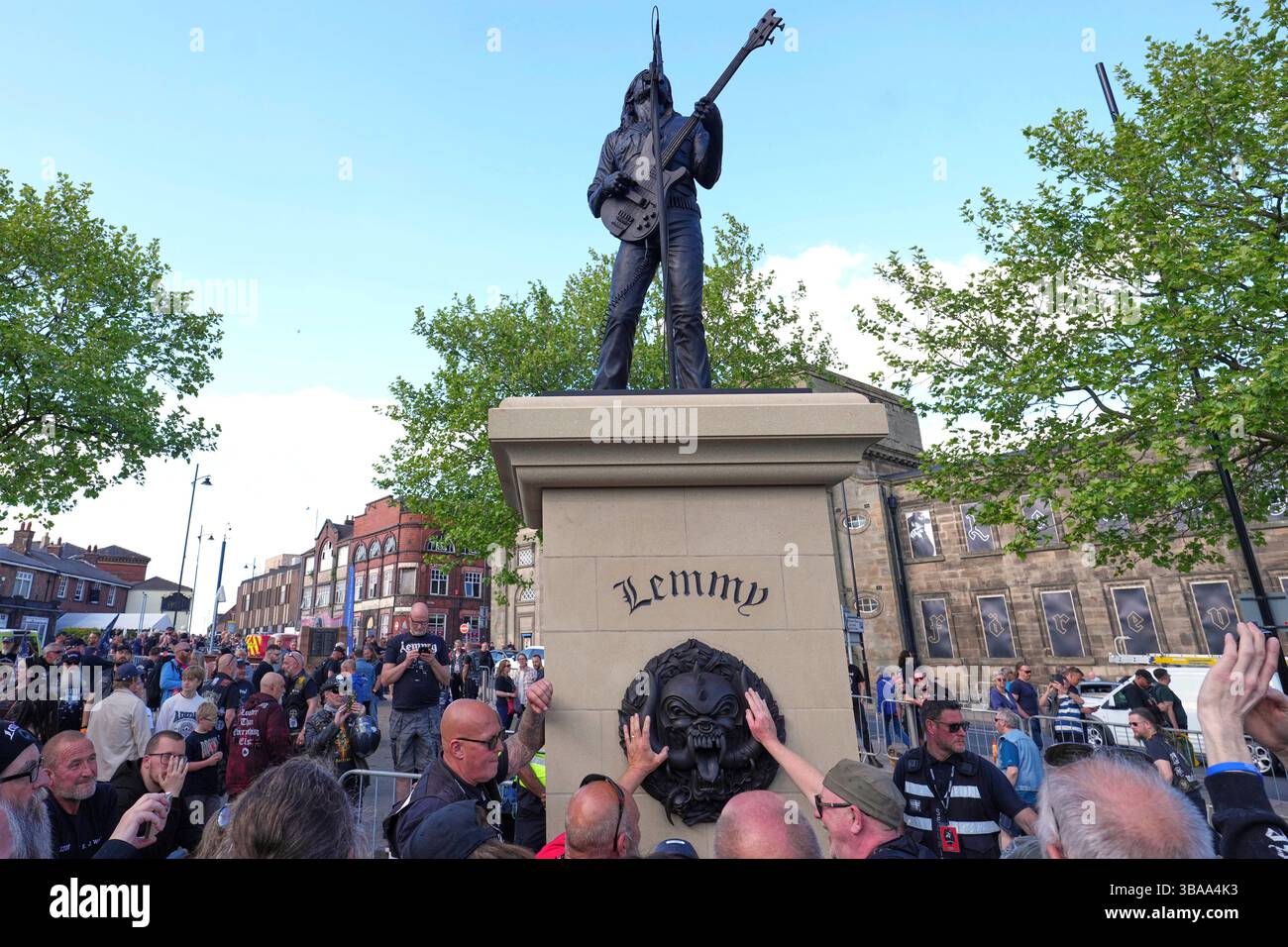 Motorhead fans touch the Motorhead logo to commemorate Lemmy Kilmister the former Motorhead ...
