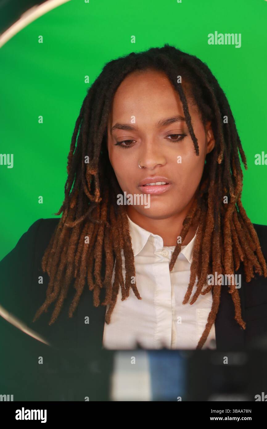 Black woman of Afro-Caribbean descent with dreadlocks dressed in formal ...