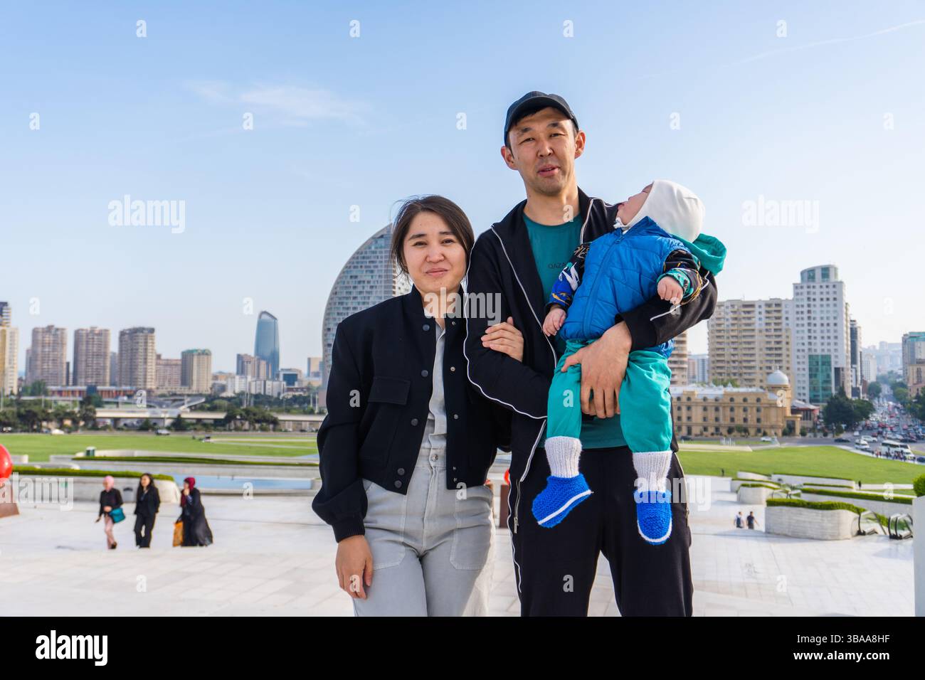 Happy family enjoy their visit to the Heydar Aliyev Center. Baku ...