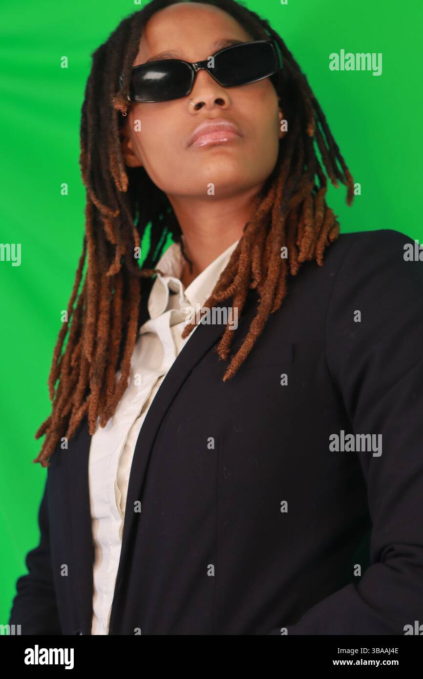Black woman of Afro-Caribbean descent with dreadlocks and sunglasses ...