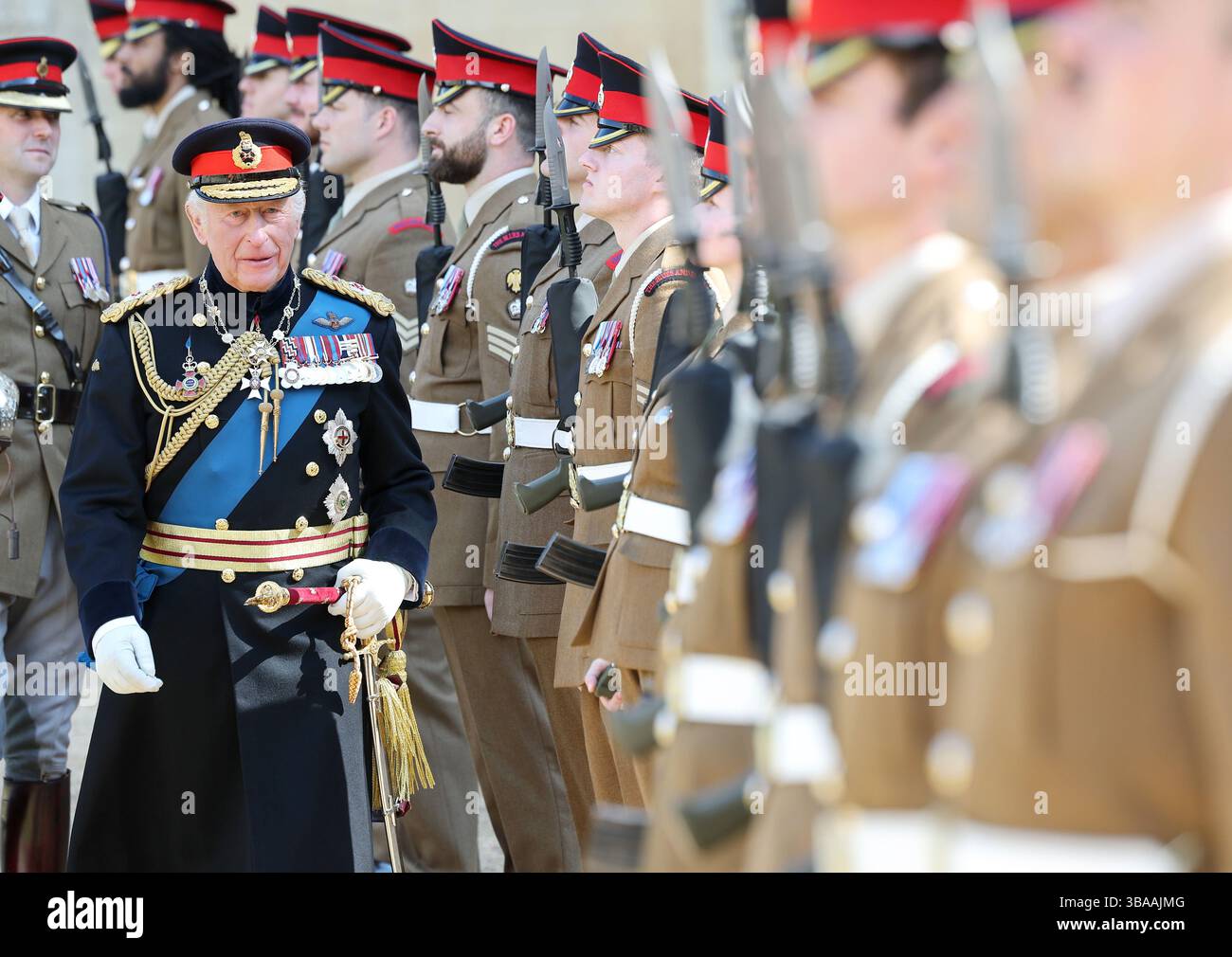 King Charles III inspects military personnel during the presentation of ...