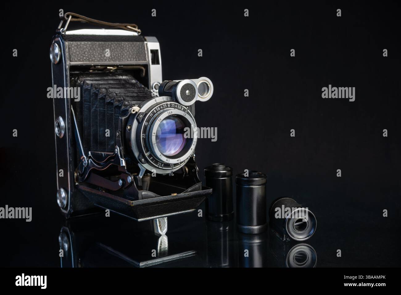 Detailed vintage camera equipped with interchangeable lenses, showcased ...