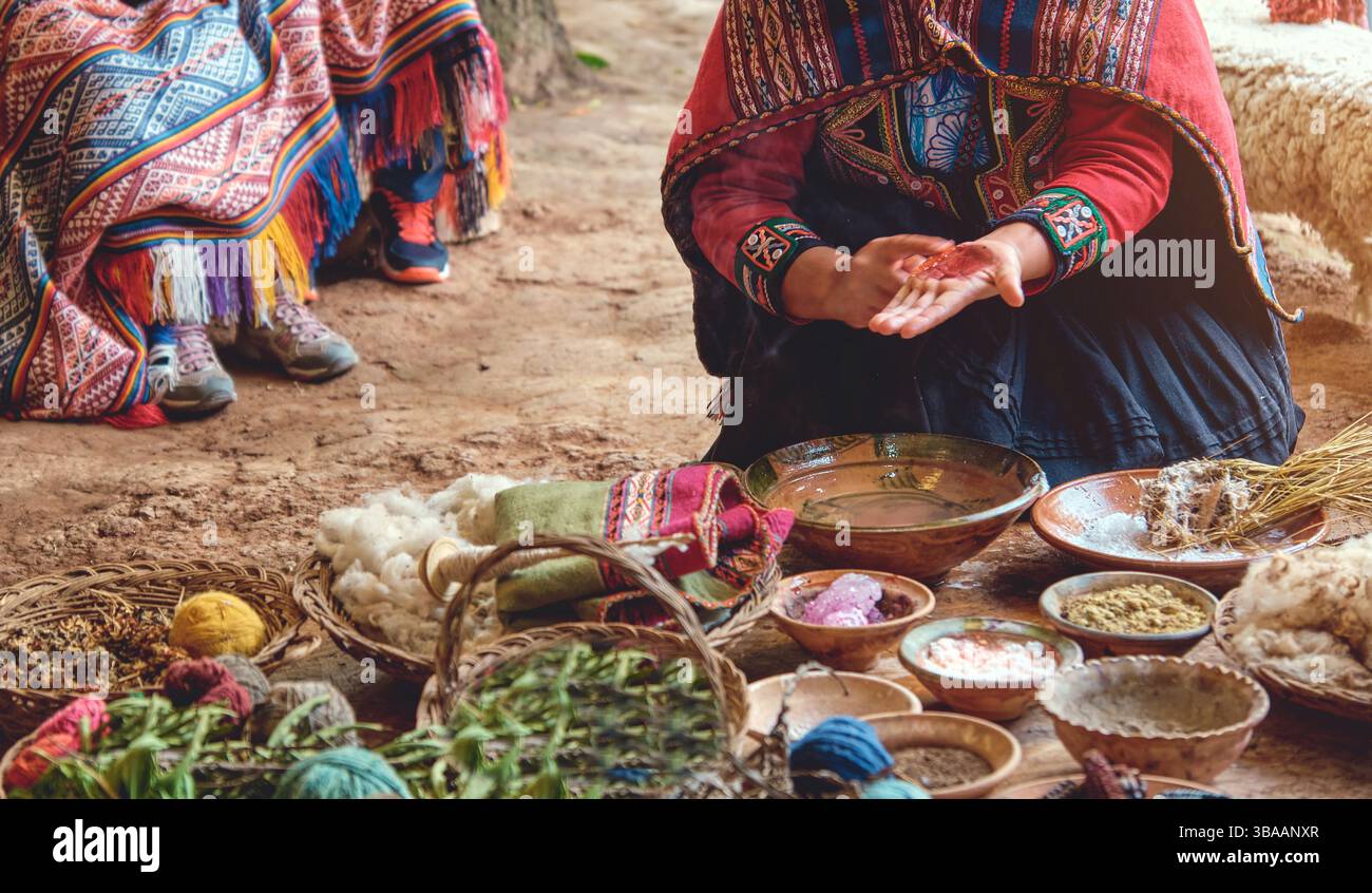 Traditional pigment material used by the incas, Andean woman working in ...