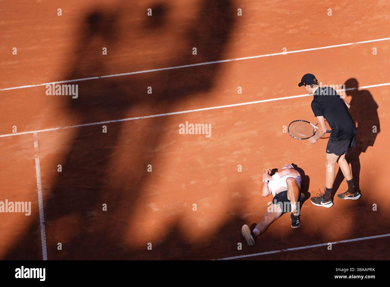 Roma, Italia. 12th May, 2025. Jannik Sinner provides assistance to ...