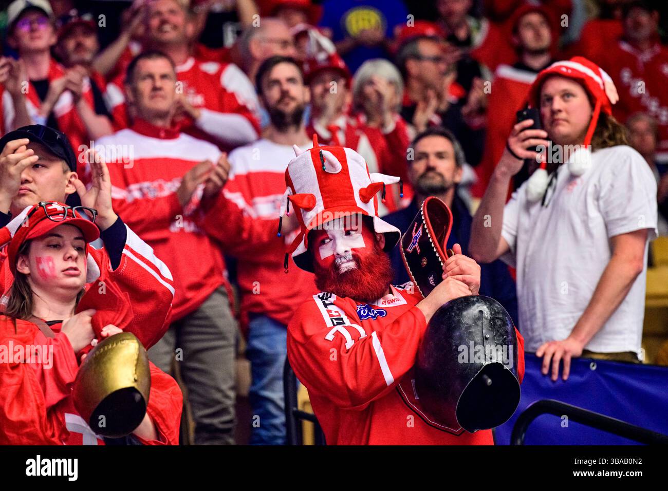 Herning, Denmark. 12th May, 2025. Swiss fans with bells are seen during ...
