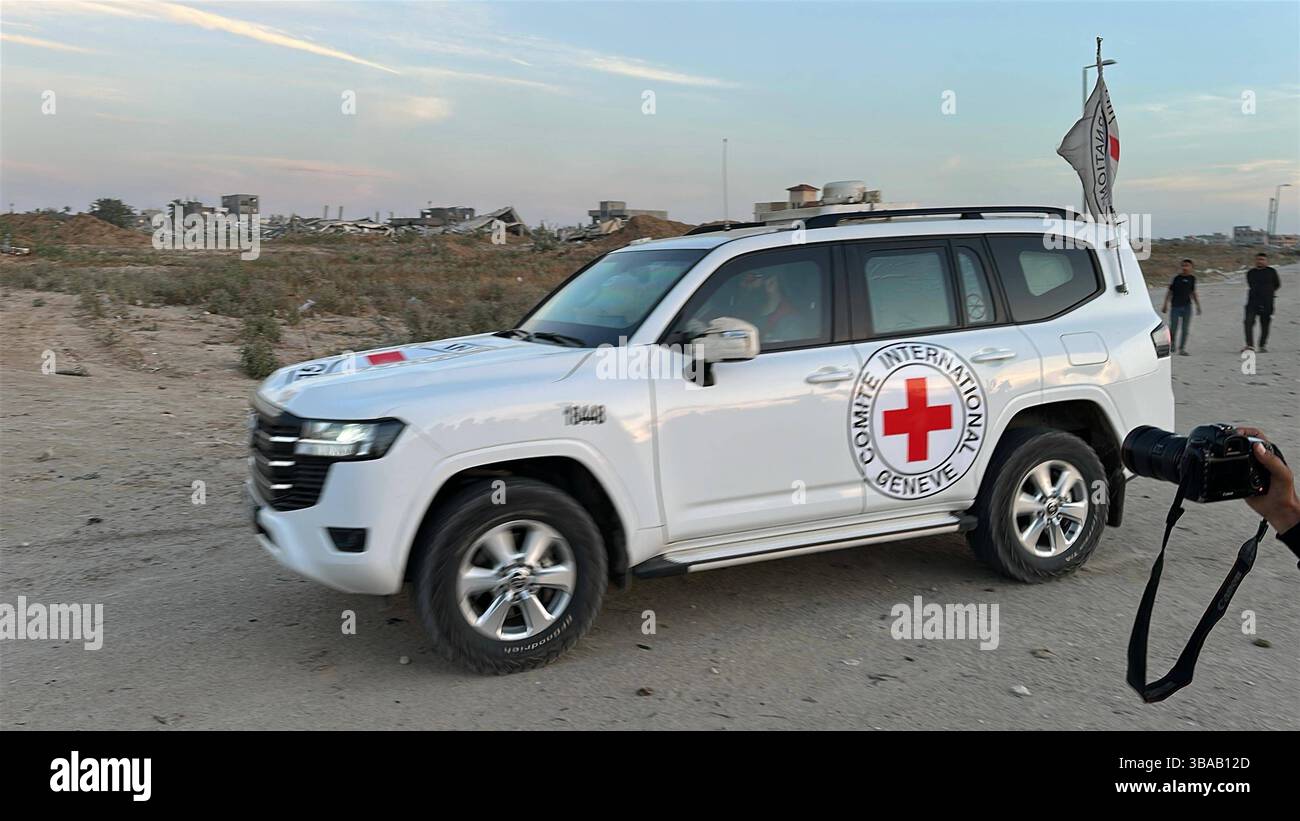 Red Cross vehicles, carrying American prisoner, Idan Alexander, leave ...