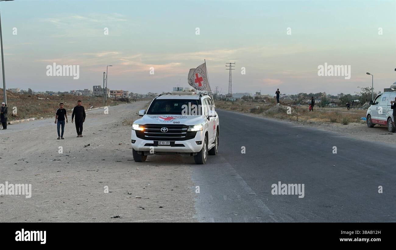 Red Cross vehicles, carrying American prisoner, Idan Alexander, leave ...