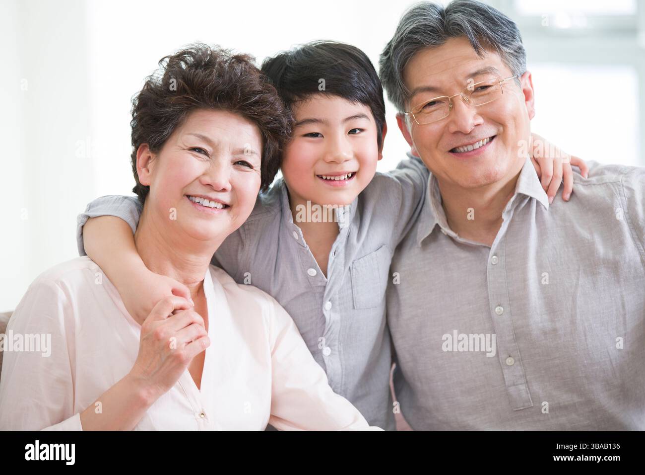 Happy Chinese grandparents and grandson Stock Photo - Alamy