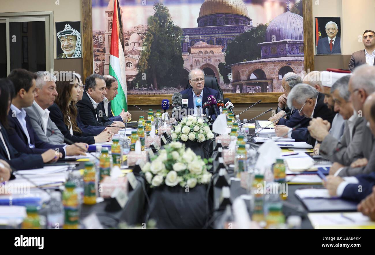 Palestinian Prime Minister Mohammad Mustafa opens the cabinet session ...