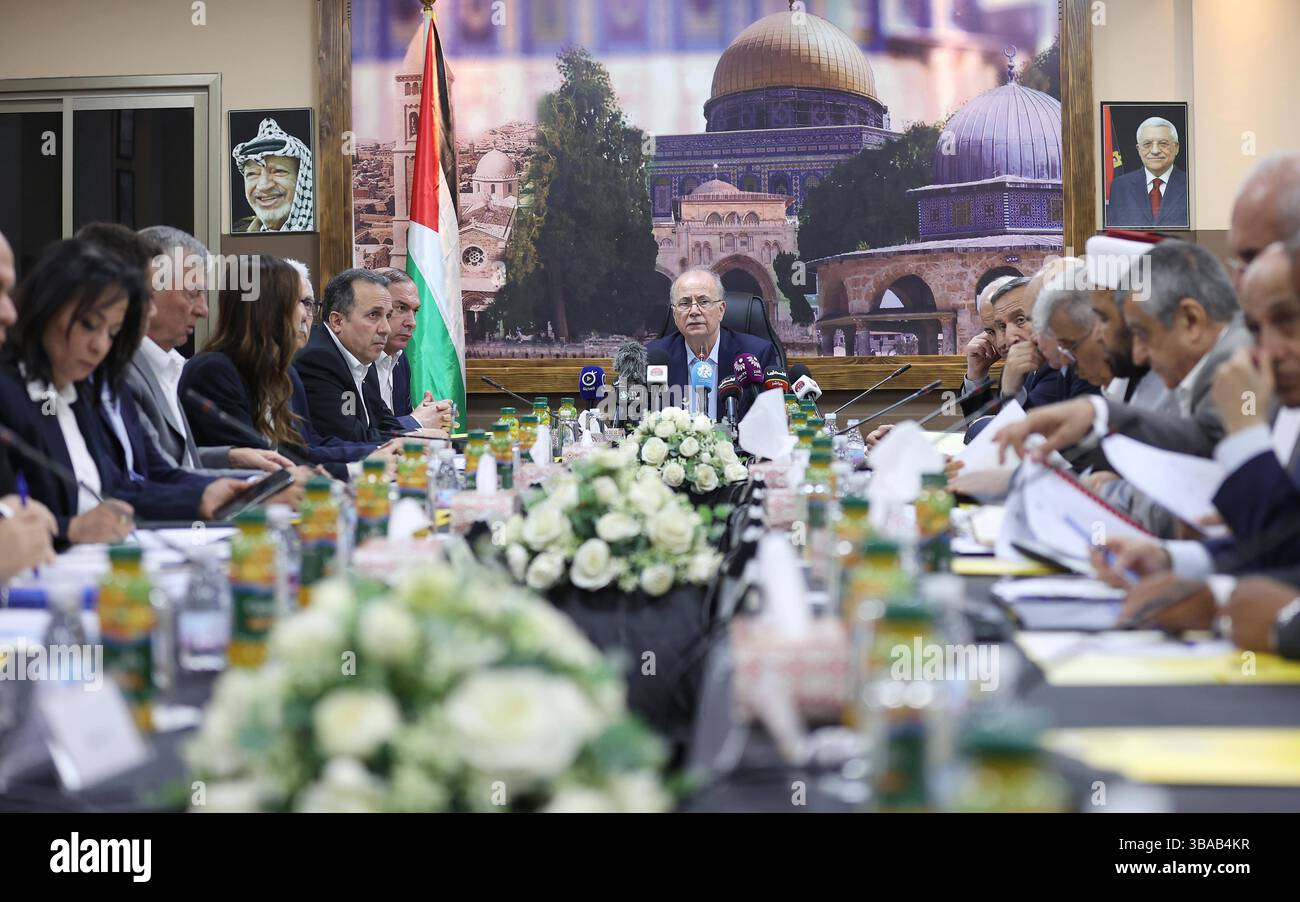 Palestinian Prime Minister Mohammad Mustafa opens the cabinet session ...