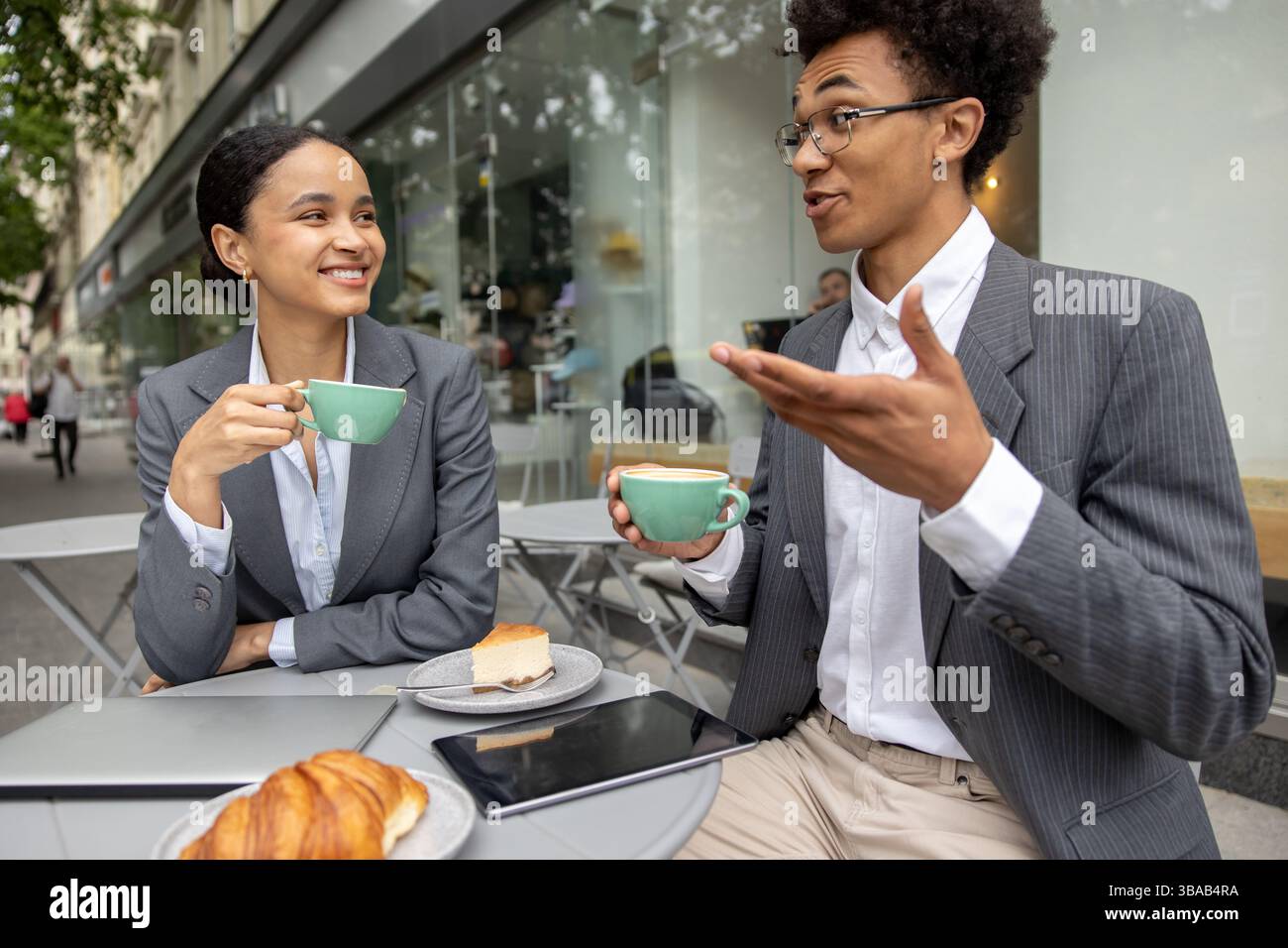 Morning at work. Business partners having coffee together Stock Photo ...