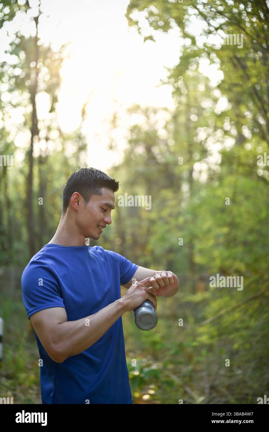 Portrait, Sporty fit millennial Asian male runner in sportswear is ...