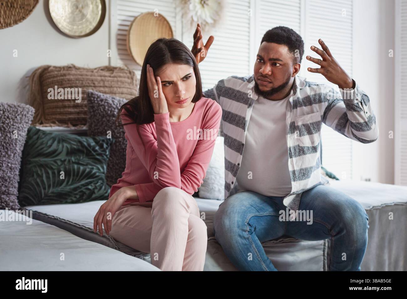 African american husband swears with wife Stock Photo - Alamy