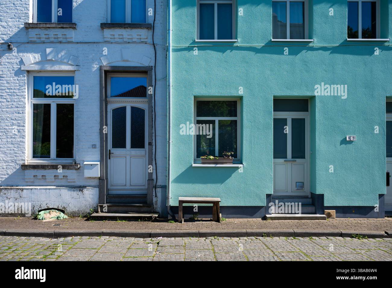 Colorful modest houses in a row in Alsemberg, Flemish Brabant, Belgium ...