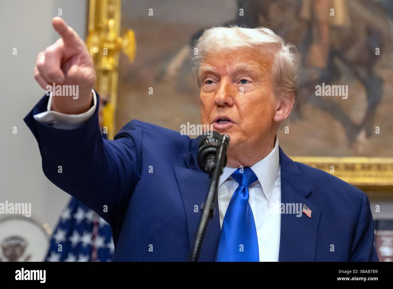 President Donald Trump answers a reporter's question during an event in ...