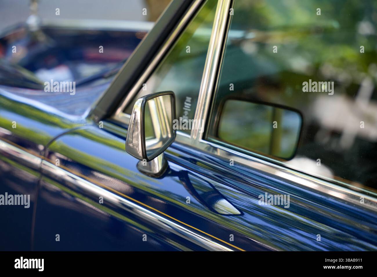 Dark blue classic car square side mirror with chrome window frames ...