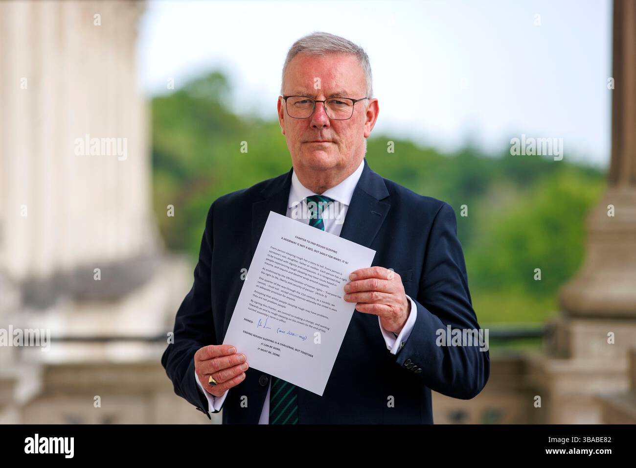 Health Minister Mike Nesbitt holding his signed copy of the People's ...