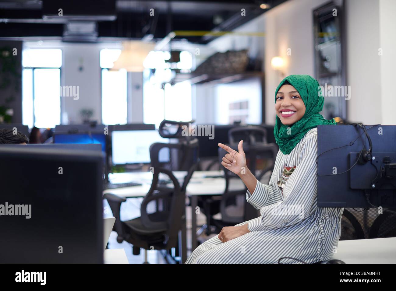 Portrait of muslim african female software developer with green hijab ...
