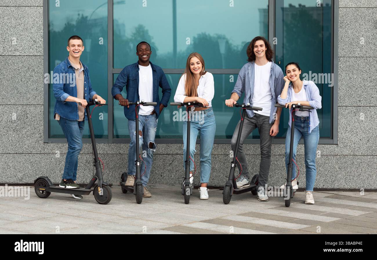Best Friends. Portrait of active diverse gang standing with electric ...