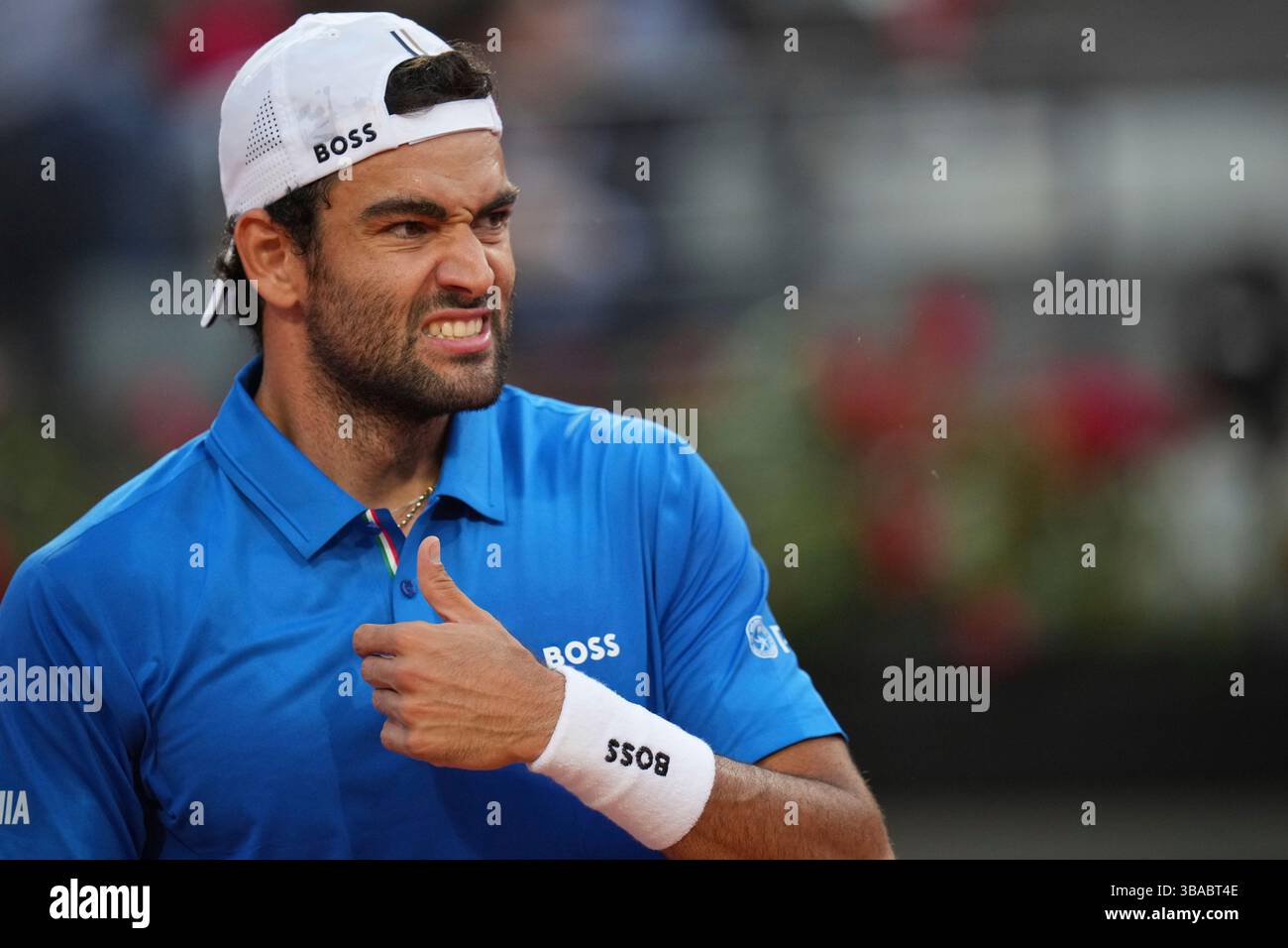 Italy's Matteo Berrettini reacts as he plays Norway's Casper Ruud ...