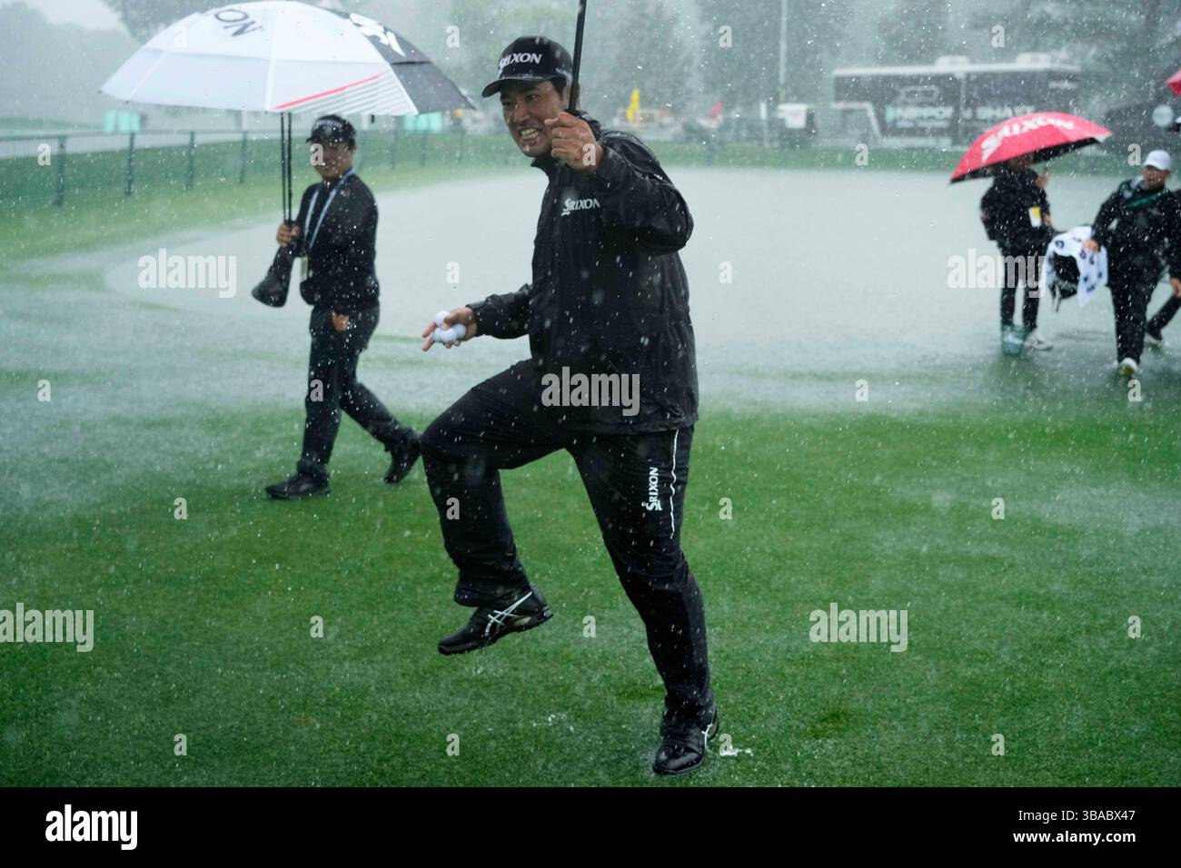 Hideki Matsuyama, of Japan, plays in the rain during a practice round ...