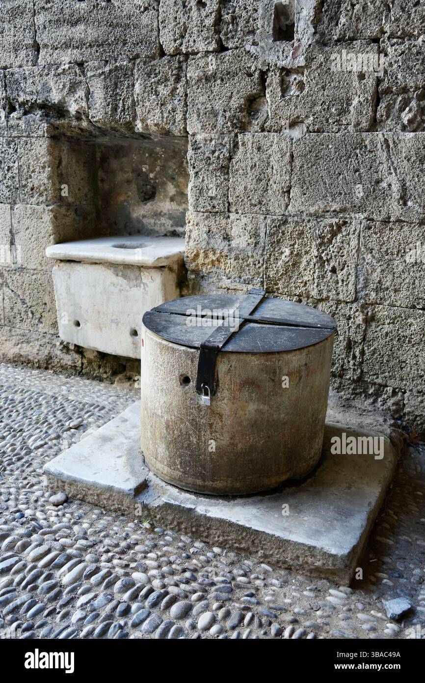 Ancient chopped well in Rhodes old town Stock Photo - Alamy