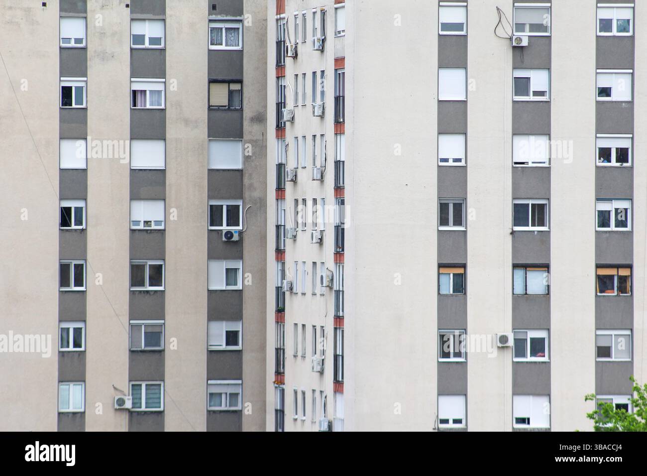 Tall apartment buildings with numerous windows and mounted air ...