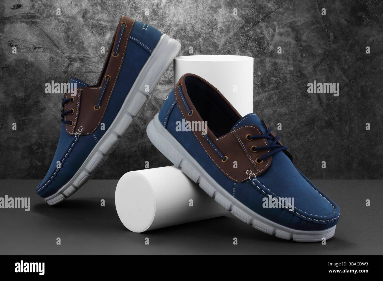 Blue men's shoes on split marble background Stock Photo - Alamy