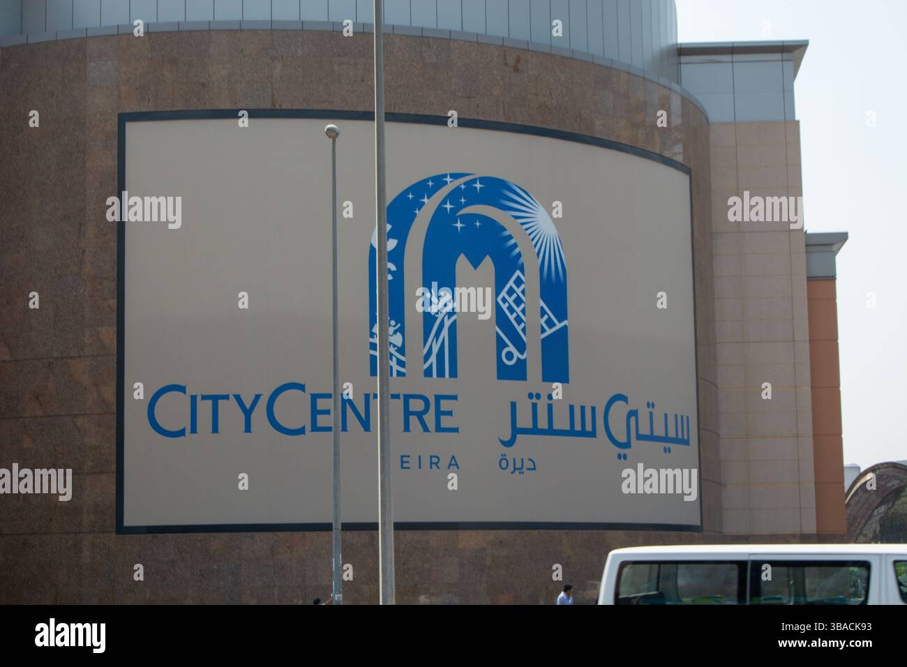 A large sign featuring the logo of City Centre Deira, a shopping mall ...