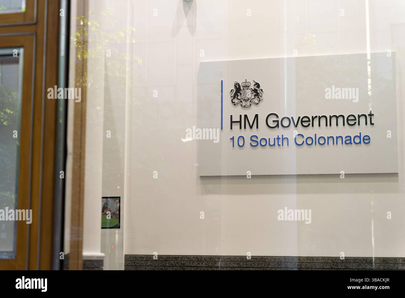 Official plague for HM Government 10 South Colonnade on white background, Government of the ...