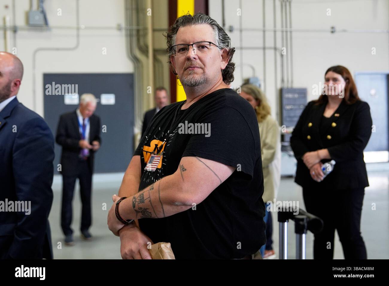 An Afrikaner refugees from South Africa looks on as Deputy Secretary of ...
