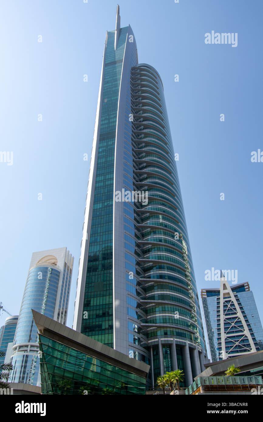 A modern skyscraper with a sleek glass facade and unique architectural ...