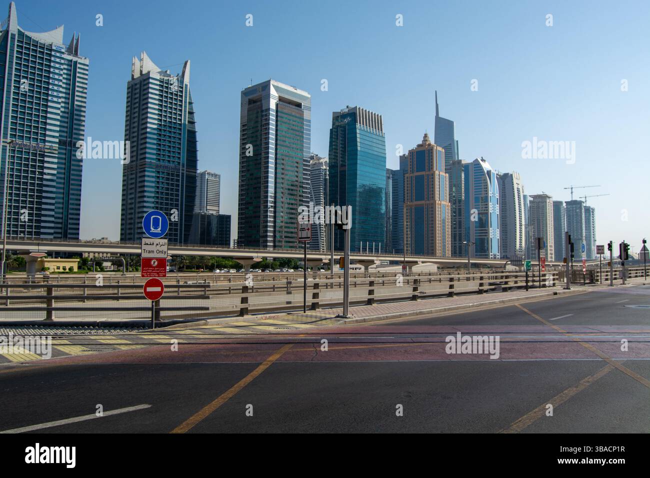 A modern cityscape featuring tall skyscrapers in Dubai, with a clear ...