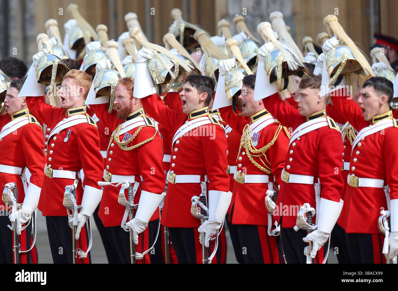 Soldiers cheer for King Charles III as he looks on after the ...