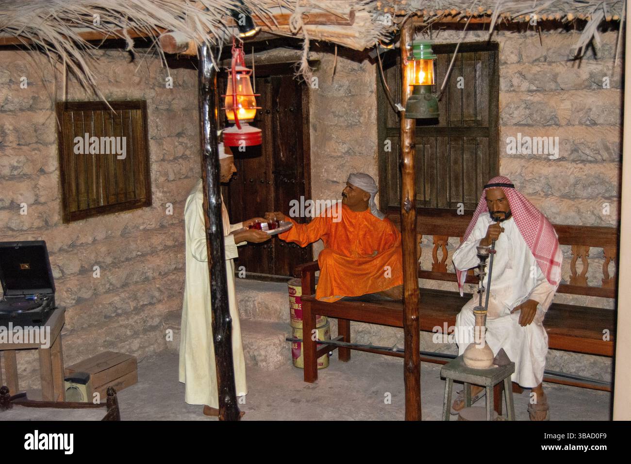 A traditional Middle Eastern setting with three men in traditional ...