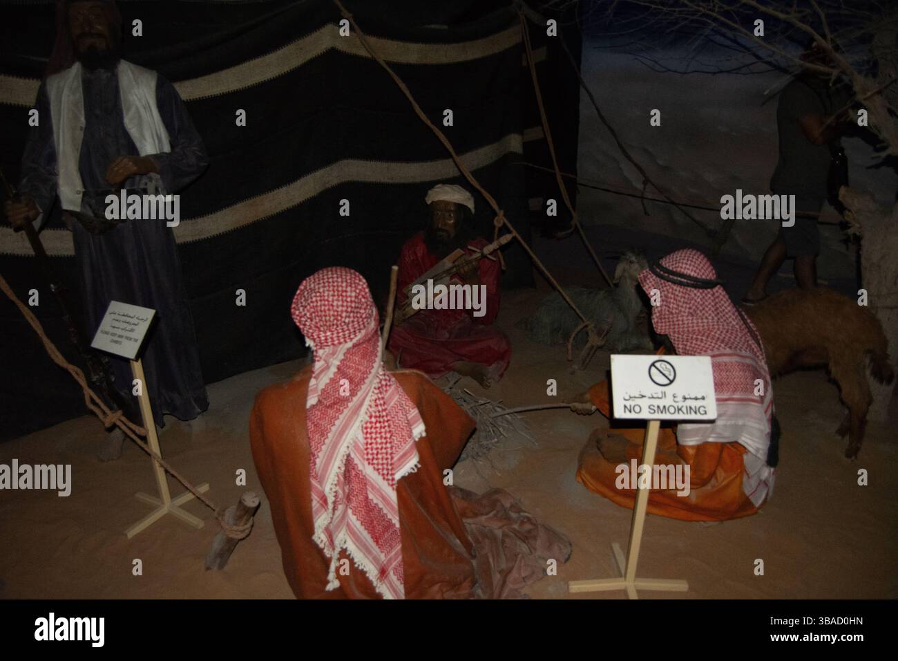 A diorama depicting traditional Middle Eastern life with figures in ...