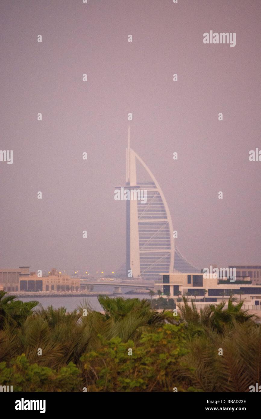 A distant view of the Burj Al Arab, a luxury hotel in Dubai, surrounded ...