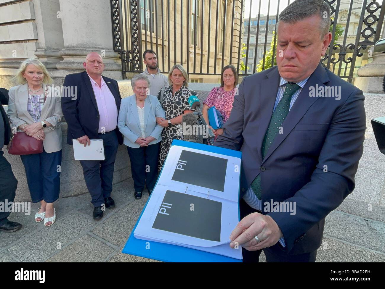 Solicitor Niall Murphy shows the extent of redacted documents given to ...