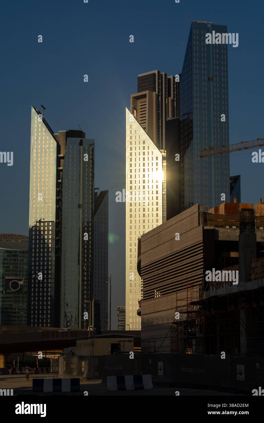 A modern cityscape featuring tall skyscrapers with reflective glass ...