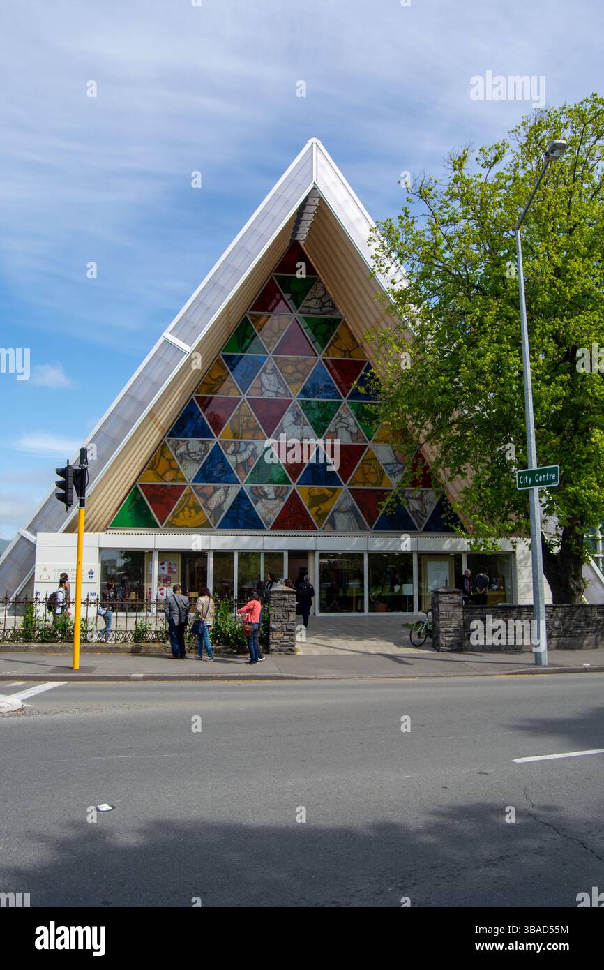 A modern building with a triangular roof featuring colorful diamond ...