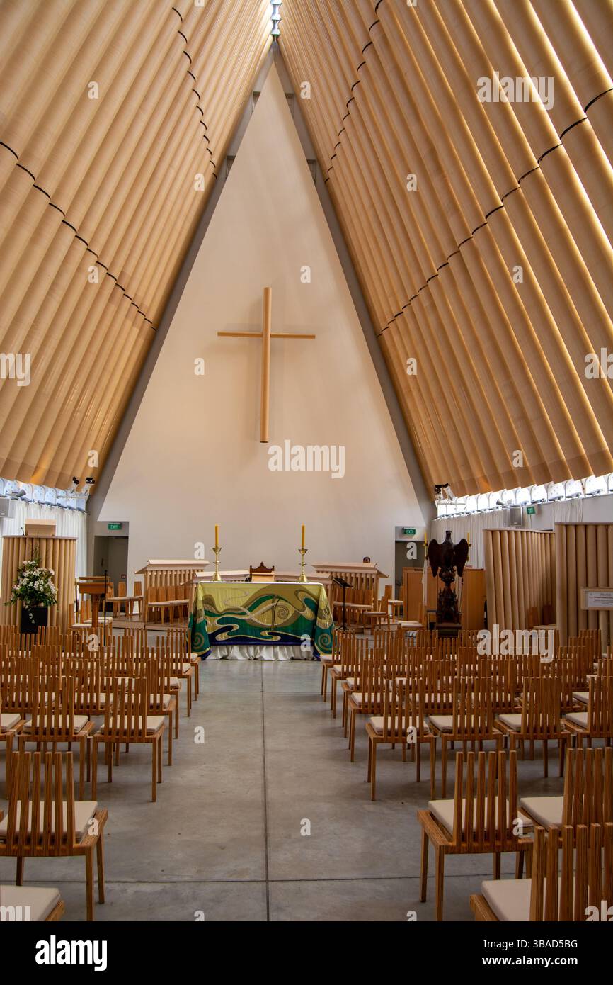 Interior view of a modern church featuring a high wooden ceiling, a ...