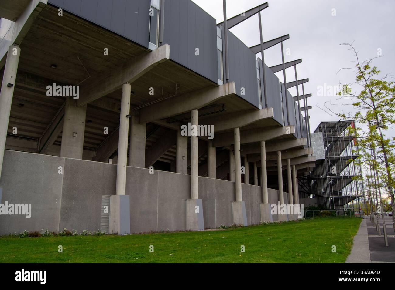 A modern architectural structure featuring concrete pillars and a sleek ...