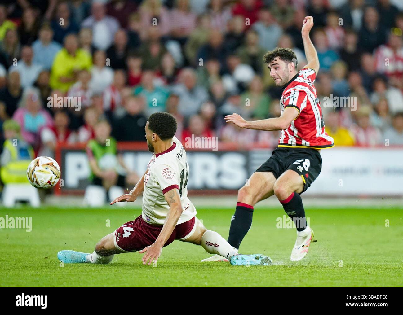 Bristol City's Zak Vyner (left) and Sheffield United's Tom Cannon ...